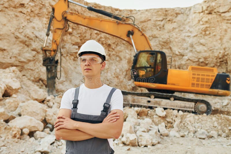 Big Career. Worker in Professional Uniform is on the Borrow Pit at ...