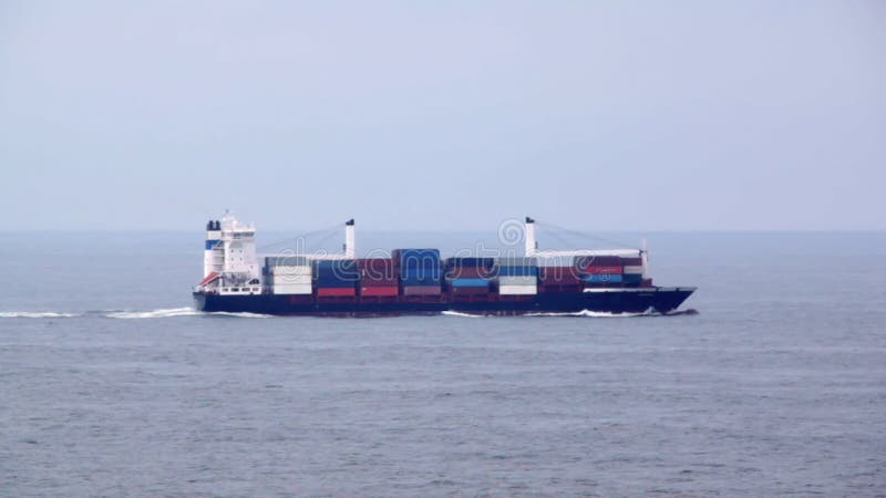 Big Cargo Ship Full of Containers Floats on Waves Stock Footage - Video ... Big Cargo Ship Full of Containers Floats on Waves Stock Footage - Video ...
