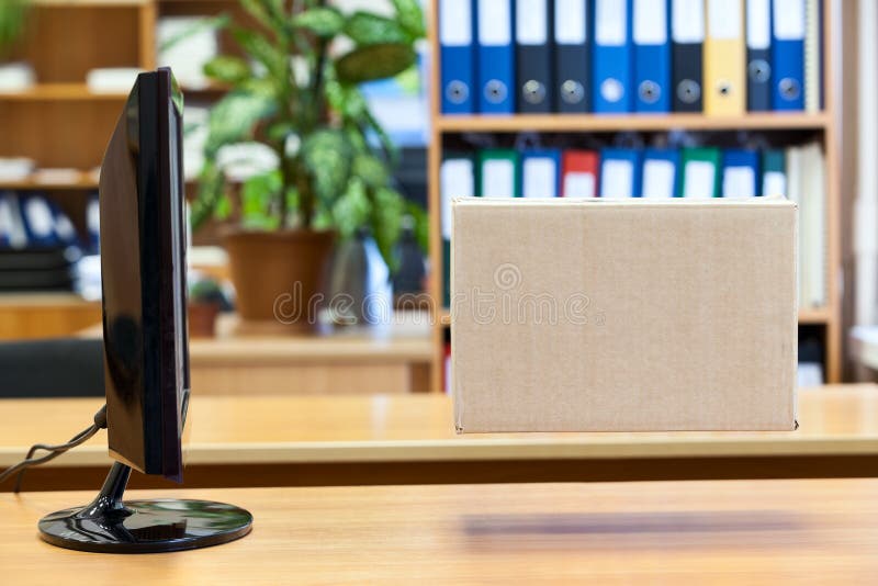 Big Carton Box Hanging in Front of Monitor Stock Photo - Image of ...