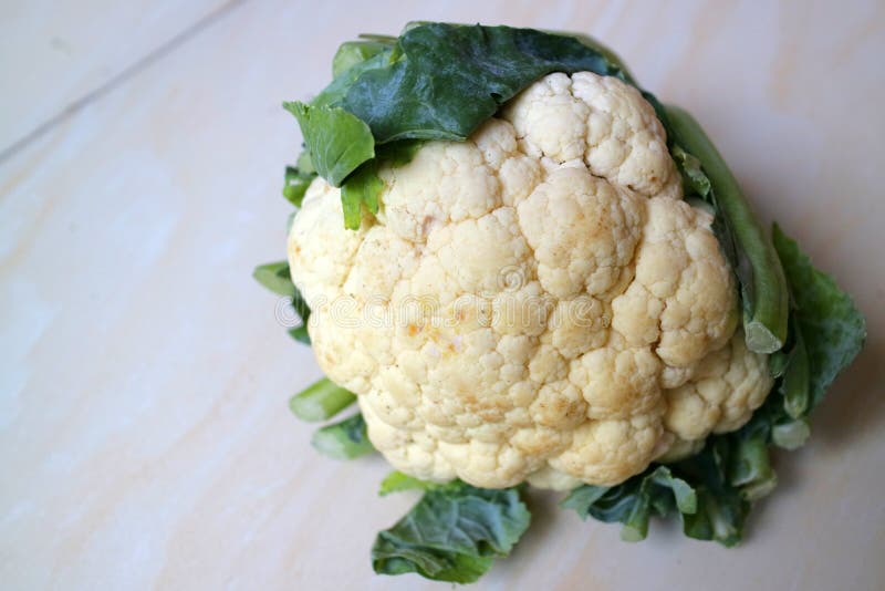 Big Cauliflower with Green Leaves Stock Image - Image of cutout, eating ...