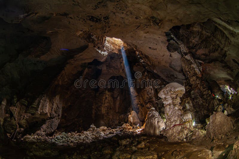 The Big Cave, the Light Shines Down on the Small Human Stock Photo ...