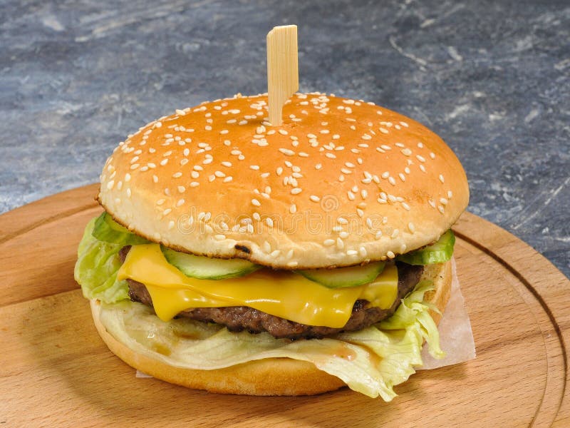 Big Cheeseburger with Beef Cheese and Cucumbers Stock Photo - Image of ...