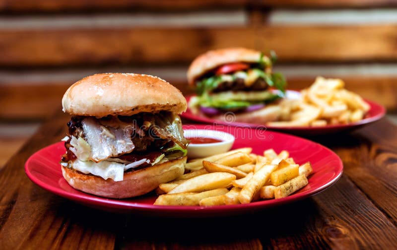 Big Cheeseburger and Chips on a Plate. Stock Image - Image of hands ...