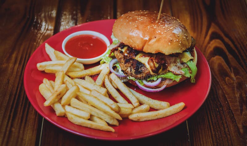 Big Cheeseburger and Chips on a Plate. Stock Photo - Image of drink ...
