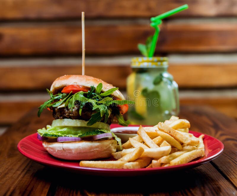 Big Cheeseburger and Chips on a Plate. Stock Photo - Image of food ...
