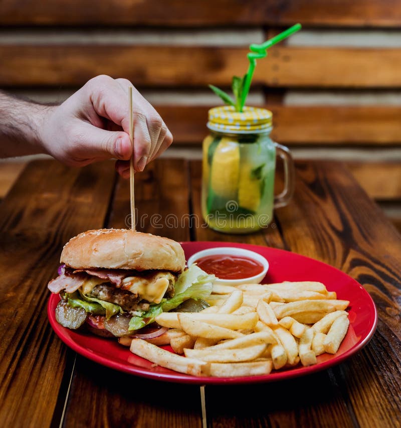 Big Cheeseburger and Chips on a Plate. Stock Image - Image of american ...