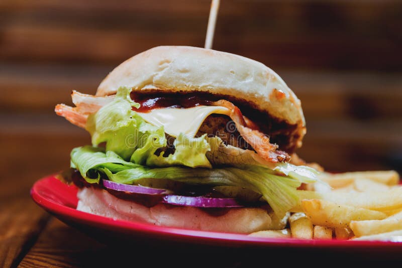 Big Cheeseburger and Chips on a Plate. Stock Image - Image of ...