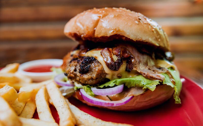 Big Cheeseburger and Chips on a Plate. Stock Image - Image of hands ...