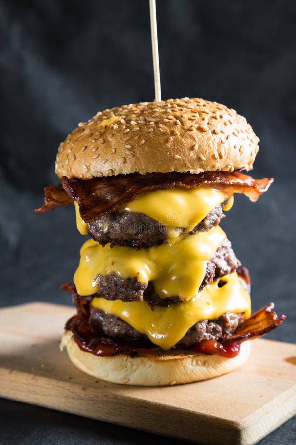 Big Triple Cheeseburger stock photo. Image of junkfood - 38308120