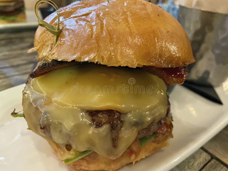 Big Cheeseburger with Ketchup at a Restaurant Stock Image - Image of ...