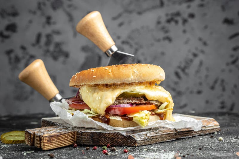 Big Cheeseburger with Melted Cheese. Fast Food Take Away Stock Photo ...