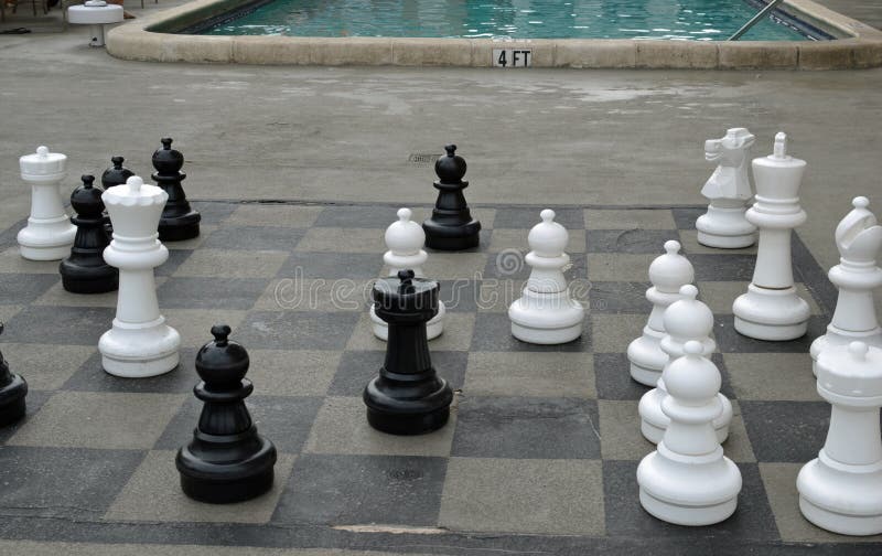 Chess pieces on ground stock photo. Image of king, black - 111194906