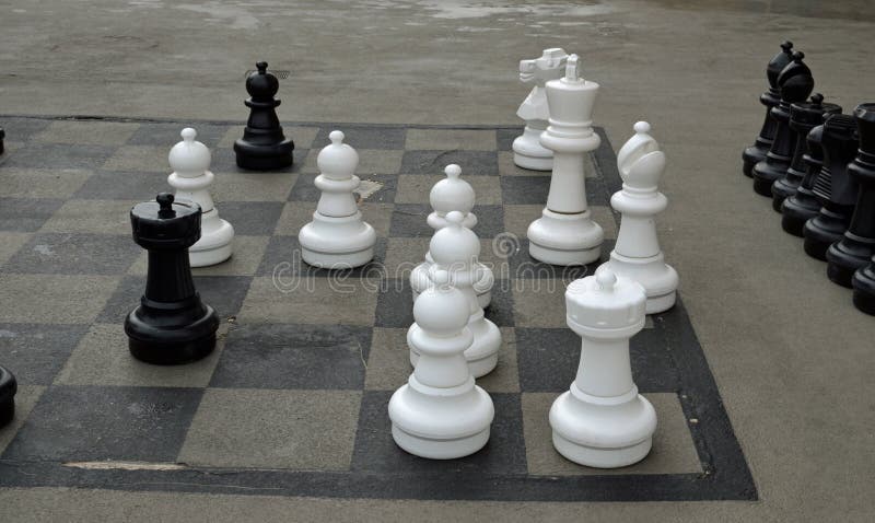 Chess pieces on ground stock image. Image of floor, pieces - 111194943