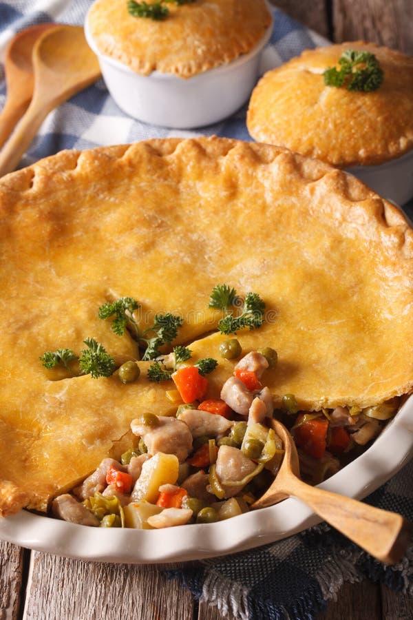 Big Chicken Pot Pie Close-up in Baking Dish. Vertical Stock Photo ...