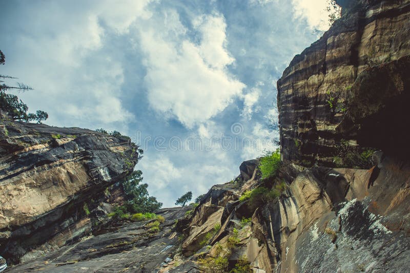 Big Cliff on Background Blue Sky with Clouds Stock Photo - Image of ...