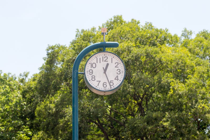 Big clock in a park stock photo. Image of park, time - 95654784