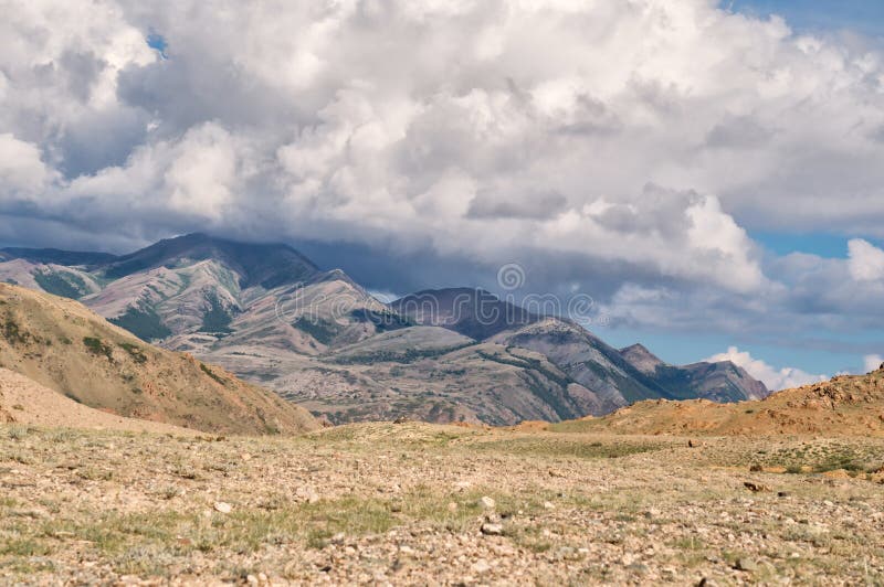 Big Cloud Lying on a Hilltop Stock Photo - Image of hill, evening: 96438300