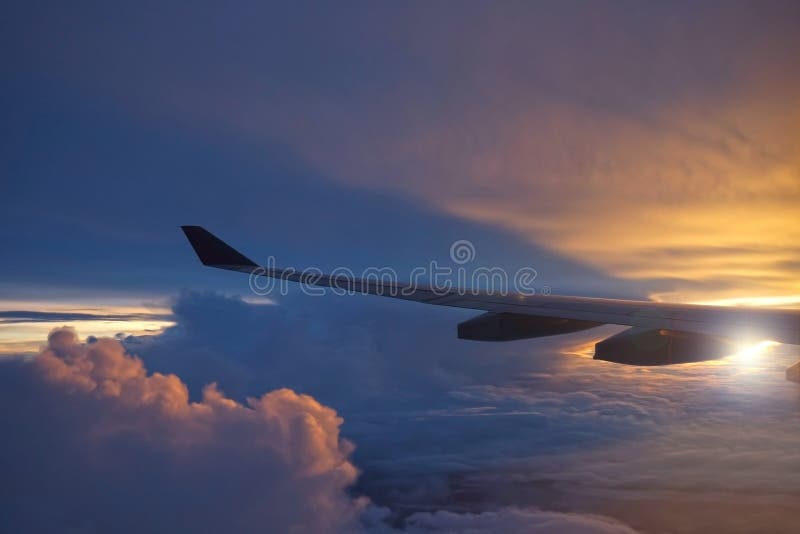 Left Wing of Airplane Over the Clouds Stock Photo - Image of large ...