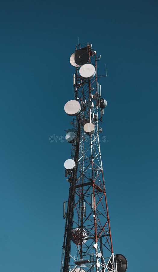 A Big Communication Tower with a Lot of GSM and Internet Antennas Stock ...