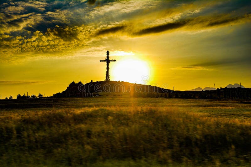 Big Cross in the Mountains on the Background of Sunset Stock Photo ...