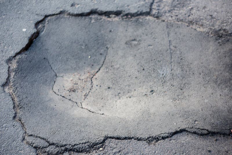 Big dent in asphalt stock image. Image of fracture, asphalt - 145780437