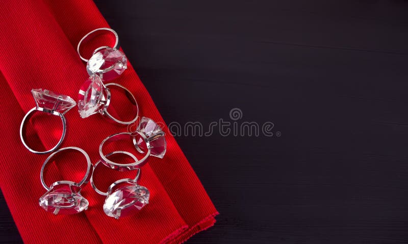 Big Diamond Rings on the Red Table Napkin. Stock Image - Image of ...