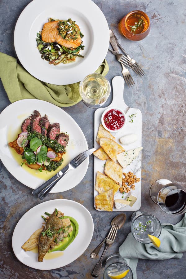 Big Dinner Table Overhead View with Steak and Fish Stock Photo - Image ...