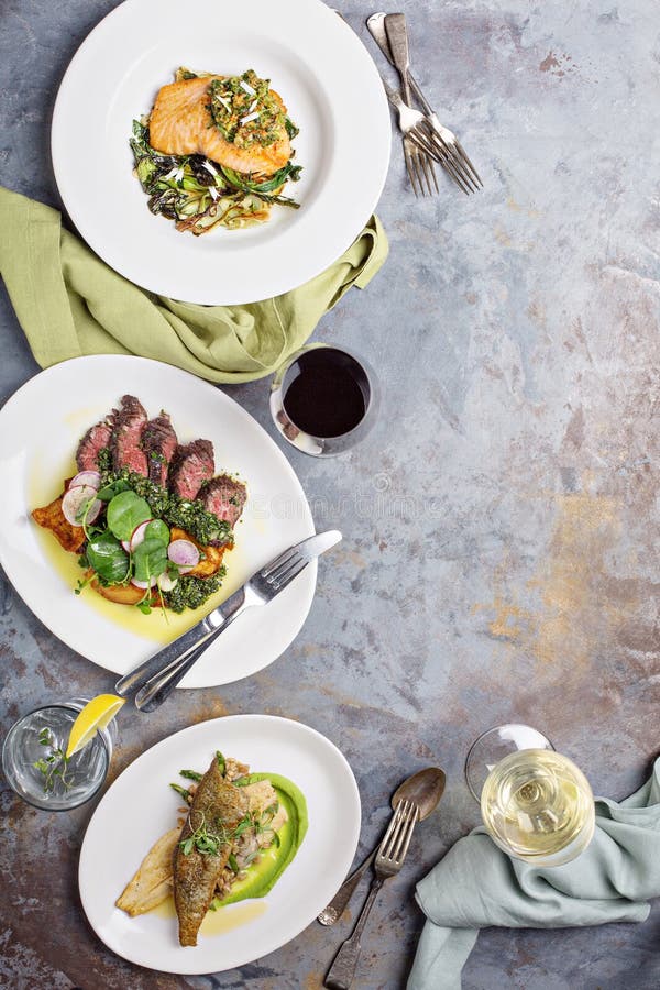 Big Dinner Table Overhead View with Steak and Fish Stock Photo - Image ...