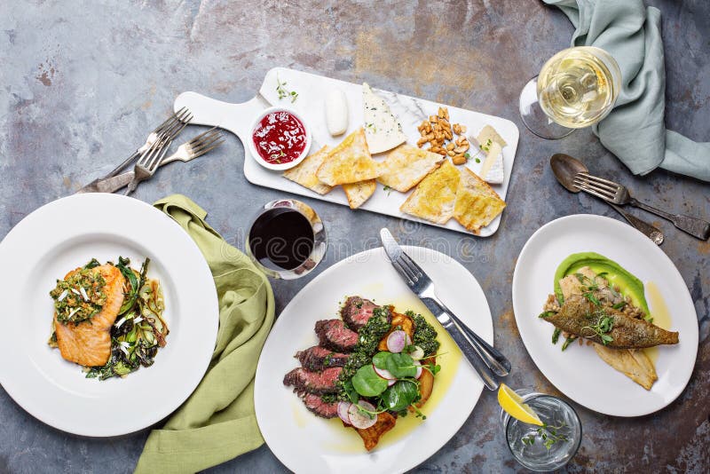 Big Dinner Table Overhead View with Steak and Fish Stock Image - Image ...