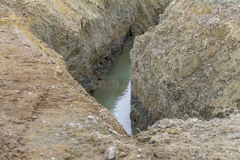 Ditch with water stock photo. Image of works, construction - 117514448