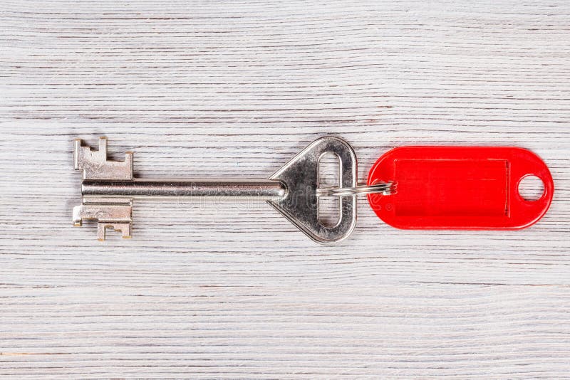 Big Door Key with Red Keychain on Wooden Table Stock Photo - Image of ...