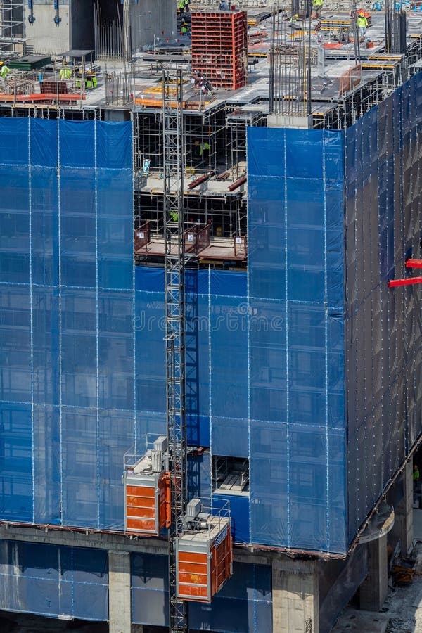 Big Elevator on the Exterior of a New Building Construction Stock Photo ...