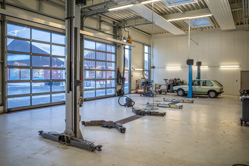 In Big Empty Car Workshop There are Some Car Lifts Stock Image - Image ...