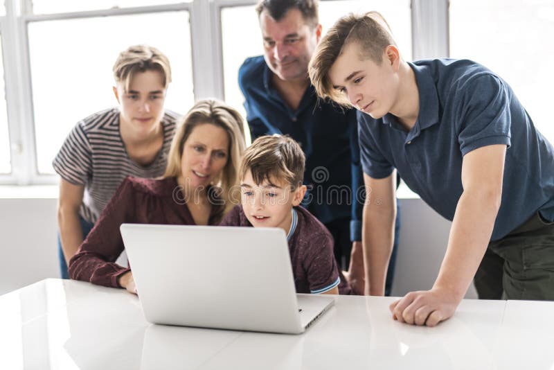A Big Family Looking in Computer at Home Stock Photo - Image of female ...