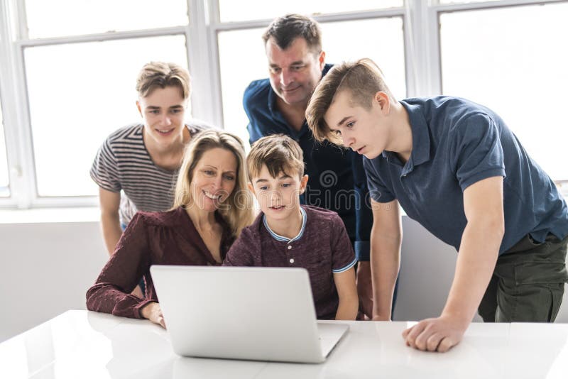 A Big Family Looking in Computer at Home Stock Photo - Image of home ...
