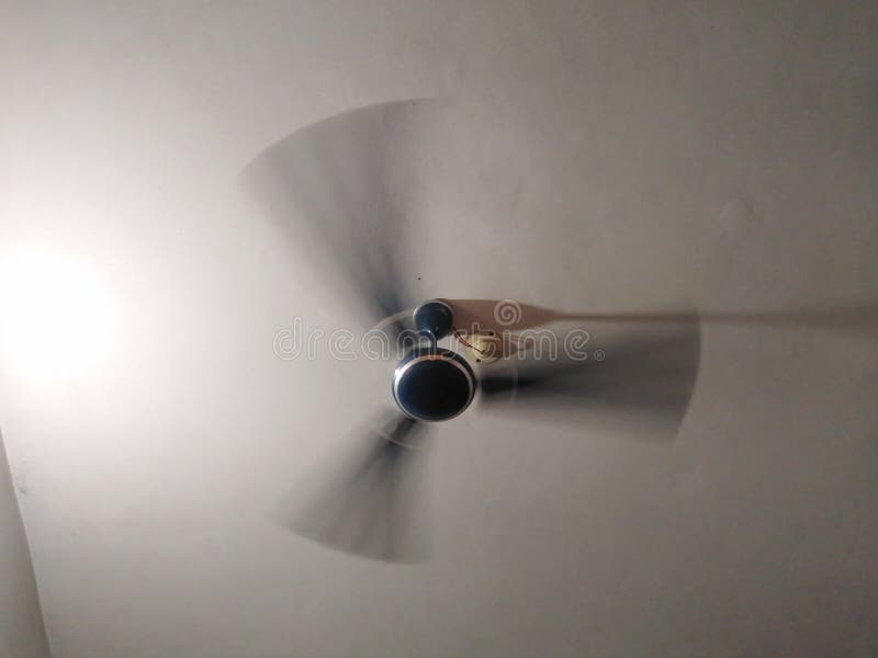 Big Fan Hanging on the Ceiling in Dark Tone. Moving Electric Ceiling ...