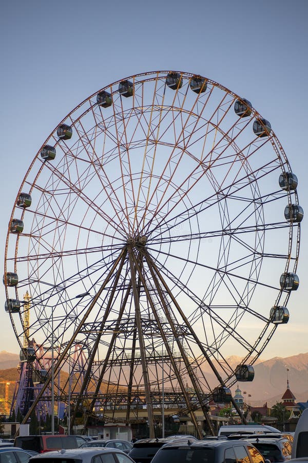 Big Ferris Wheel in the Rays of Sunset. Stock Image - Image of sunset ...