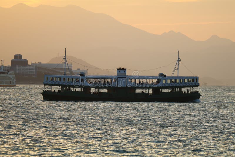 Big Ferry Ship on the Water Surface with Mountains and Buildings in the ...