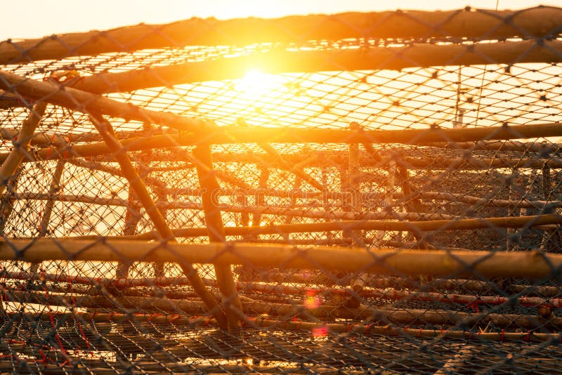 Big Fish Trap on the Quay Near the Sea with Sunset Stock Photo - Image ...
