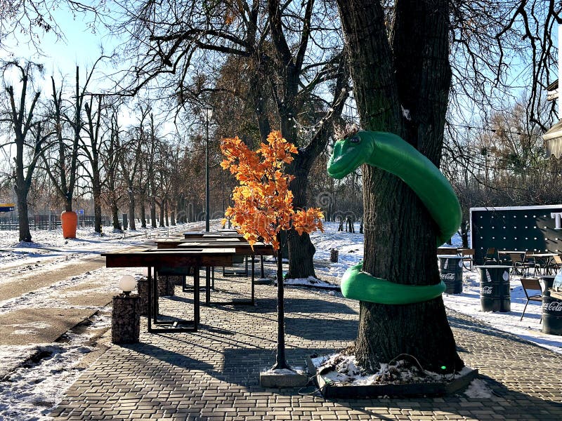 Green snake on the tree editorial image. Image of sculpture - 351414645