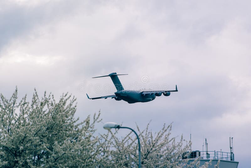 Big Grey Plane Taking Off from Airport. Control Tower in a Flowering ...