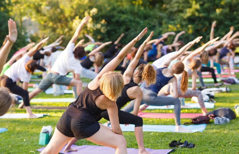 Big Group of Adults Attending a Yoga Class Outside in Park Stock Photo ...