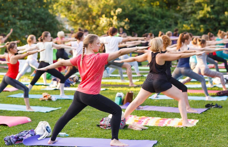 Big Group of Adults Attending a Yoga Class Outside in Park Stock Image ...