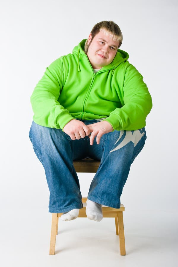 Big guy sitting on a chiar stock photo. Image of smile - 14323018