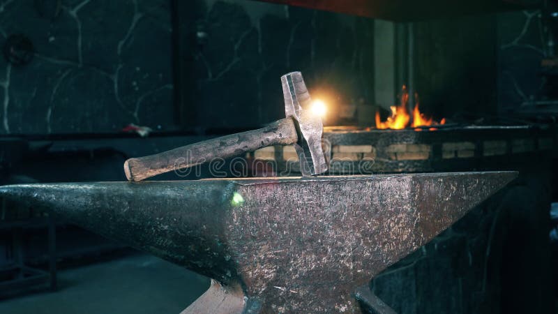Hammer on Anvil in Forge on Fire Background in Which Worker Throws ...