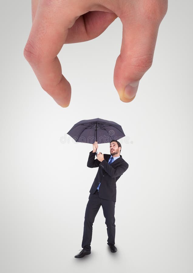 Big Hand Trying To Catch a Small Scared Business Man Stock Photo ...