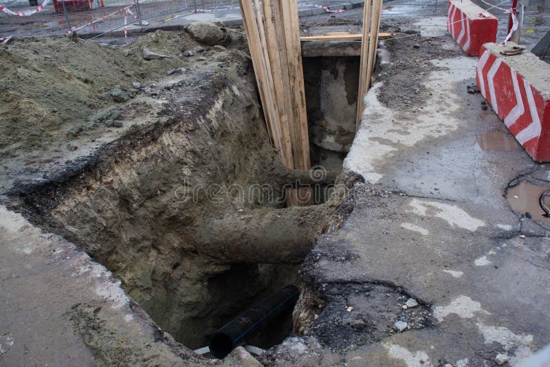 Big Hole in Road Made for Road Repairing Works with Caution Sign Stock ...