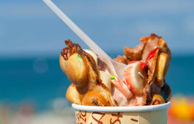 Big Ice-cream in Bubble Waffle on a Beach. Closeup Stock Image - Image ...