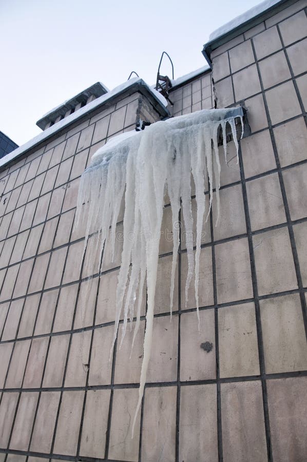 The Big Icicles Under a House Roof Stock Photo - Image of frost ...