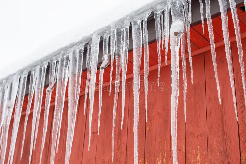 Big Icicles Hanging from Red Barn Gutter Stock Image - Image of barn ...